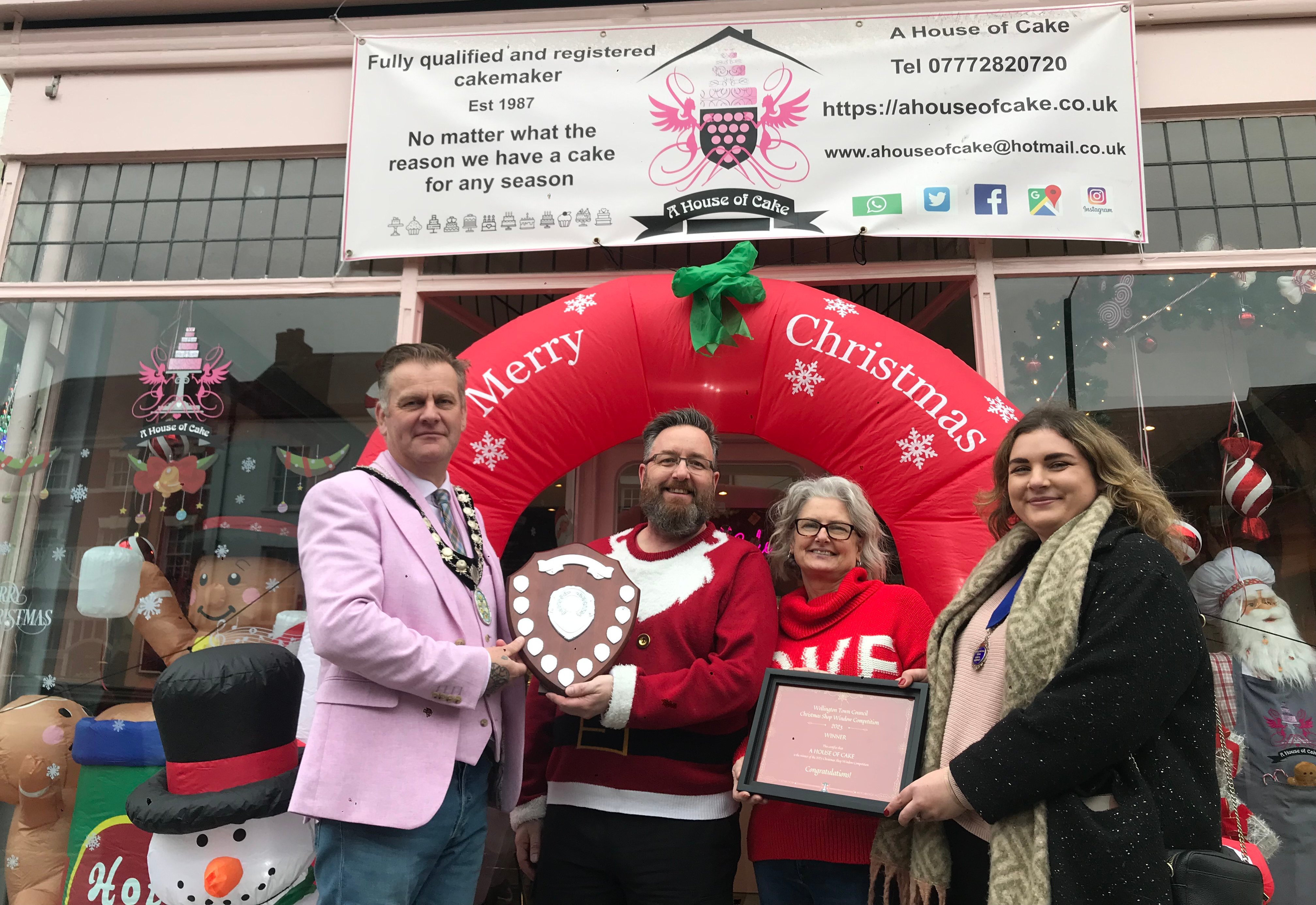 House of Cake receives town council's best Christmas shop window trophy ...